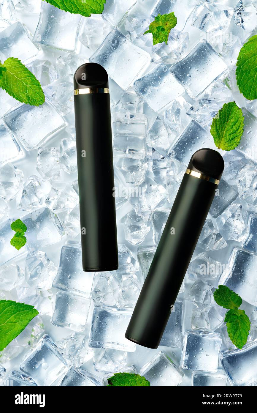 Disposable electronic cigarette on ice cubes background Stock Photo - Alamy