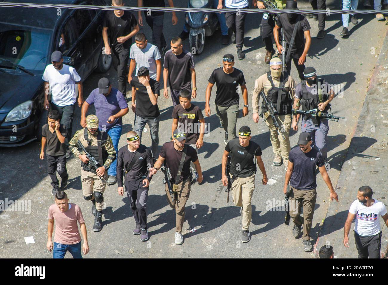 Masked gunmen take part in the funeral of Mahmoud al-Sadi, 23 years-old ...