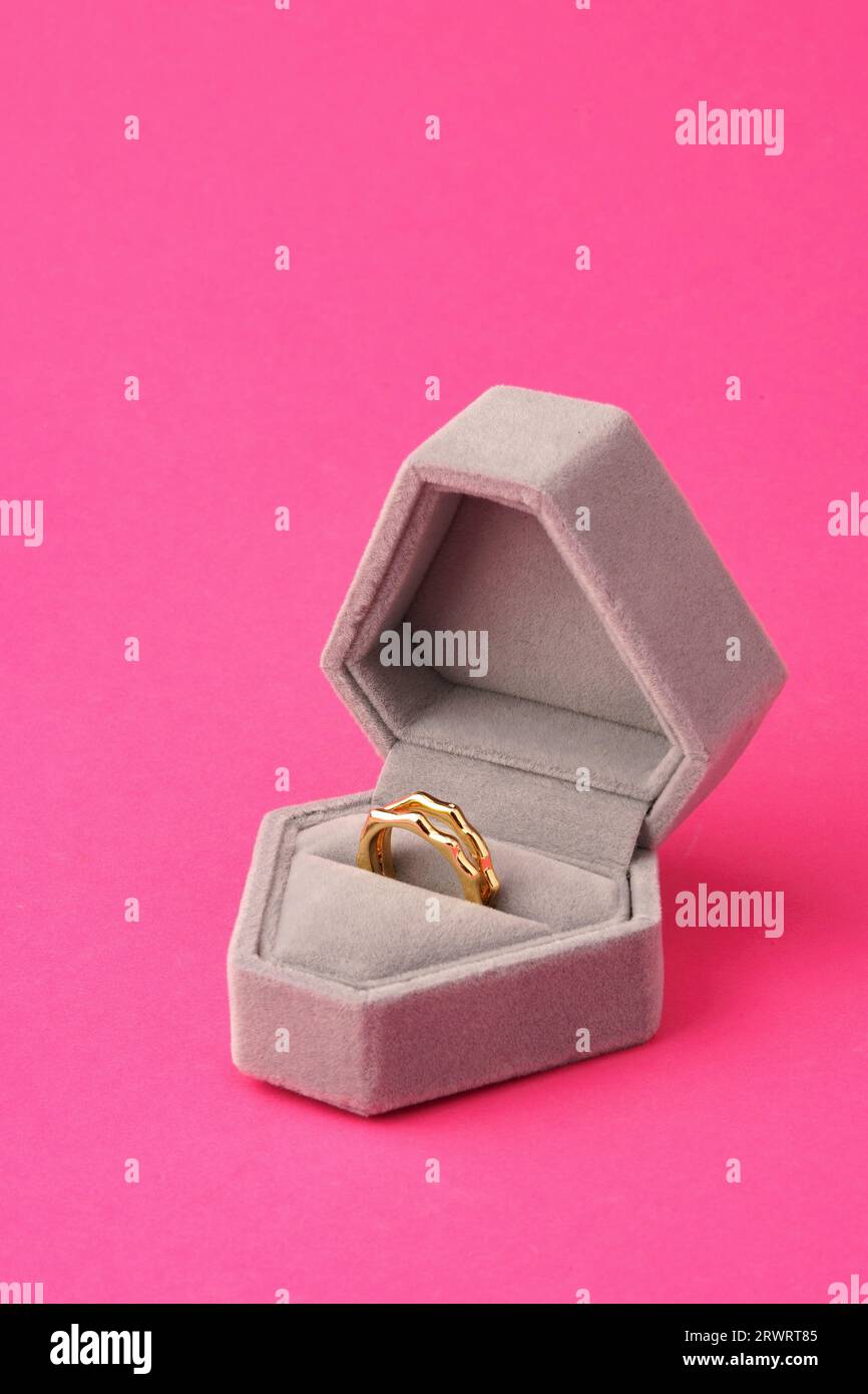 Small jewelry box on pink studio background Stock Photo - Alamy
