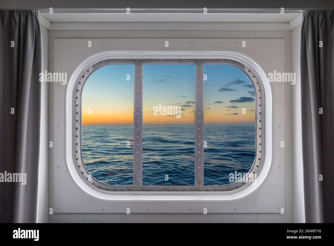 View through the cabin window of a cruise ship at evening mood, sea ...
