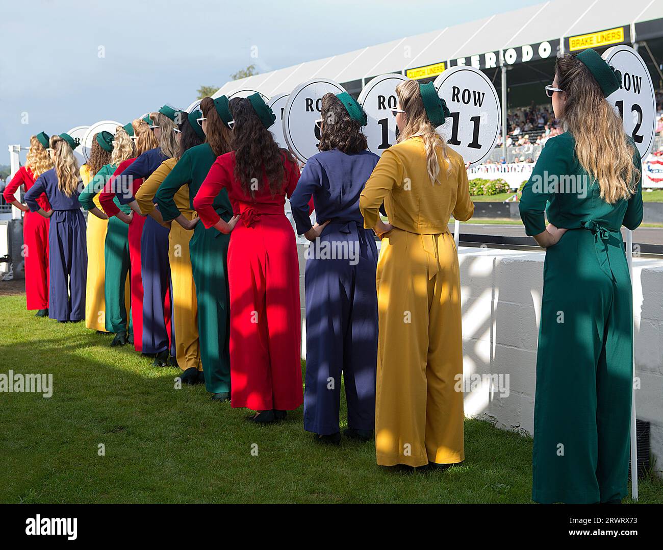 Grid Girls line up to enter the track at The Goodwood Revival Meeting ...