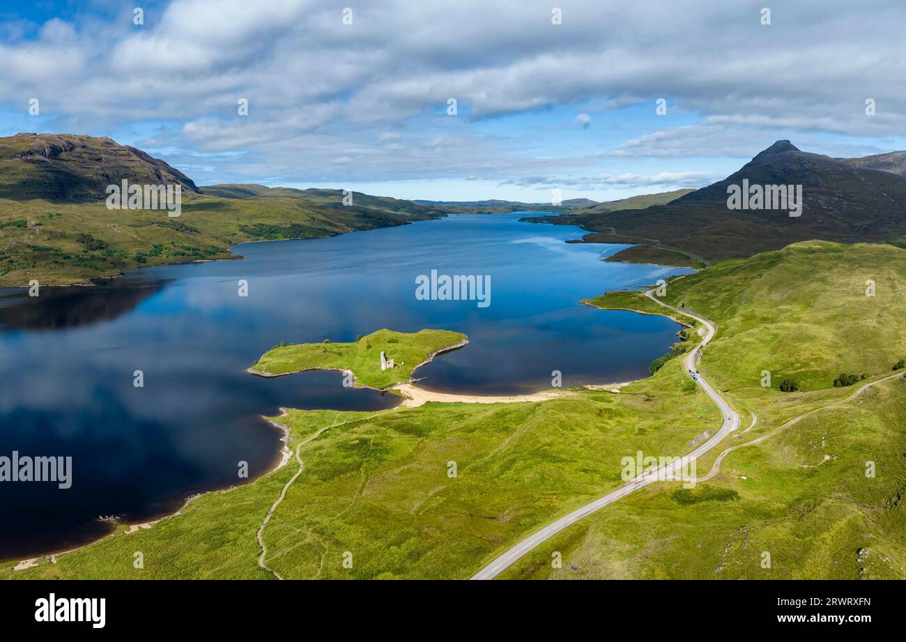 Aerial panorama of the freshwater loch Loch Assynt with the ruins of ...