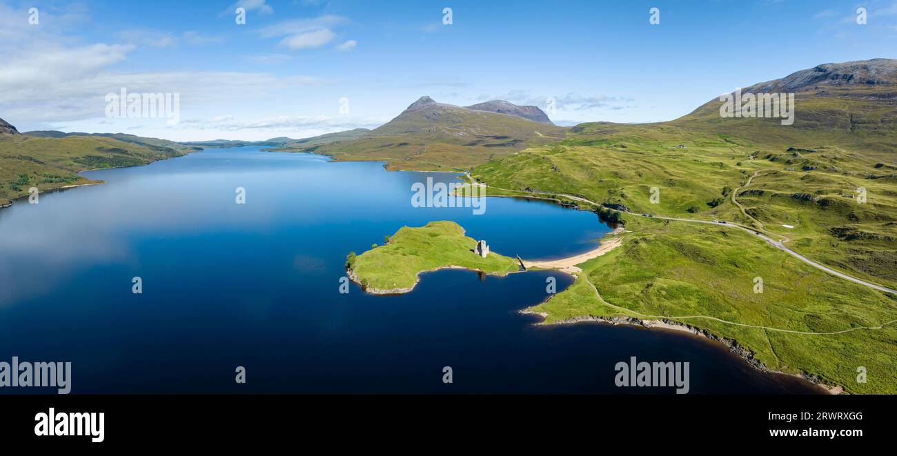 Aerial panorama of the freshwater loch Loch Assynt with the ruins of ...