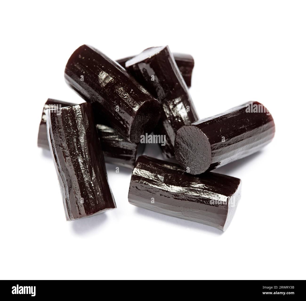 Pieces of liquorice on white Stock Photo - Alamy