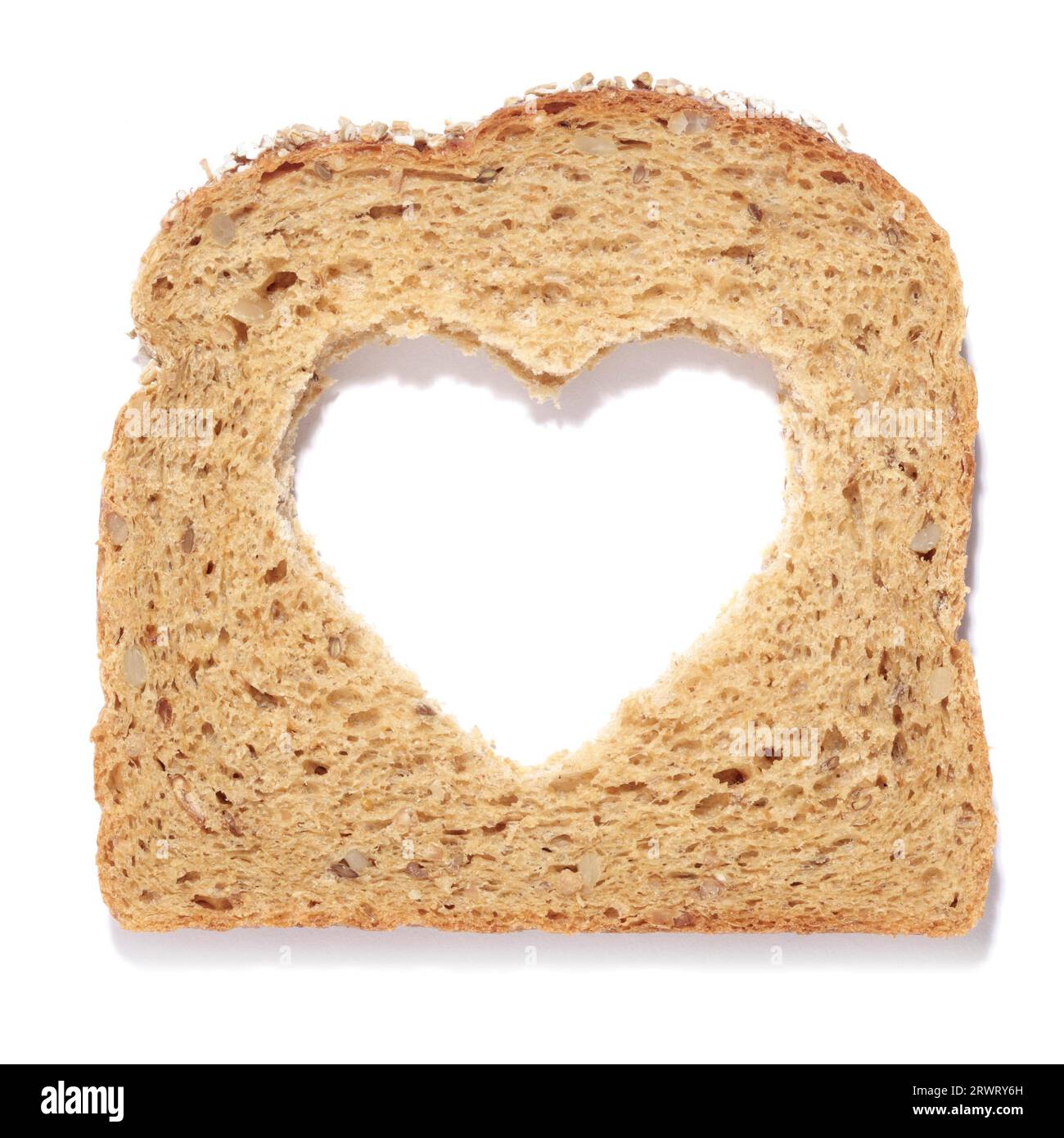 Heart shaped hole in a slice of bread Stock Photo - Alamy