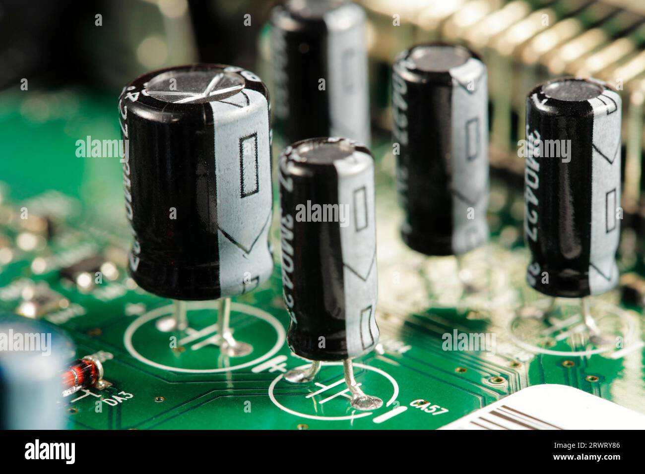 Capacitor electrical components on a circuit board Stock Photo - Alamy