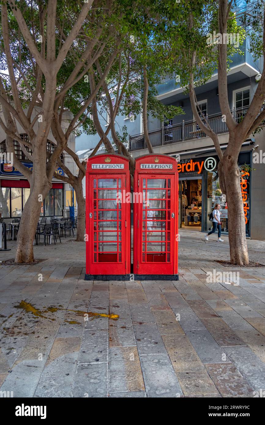 Gibraltar cityscape. Close up of empty typical English red telephone ...