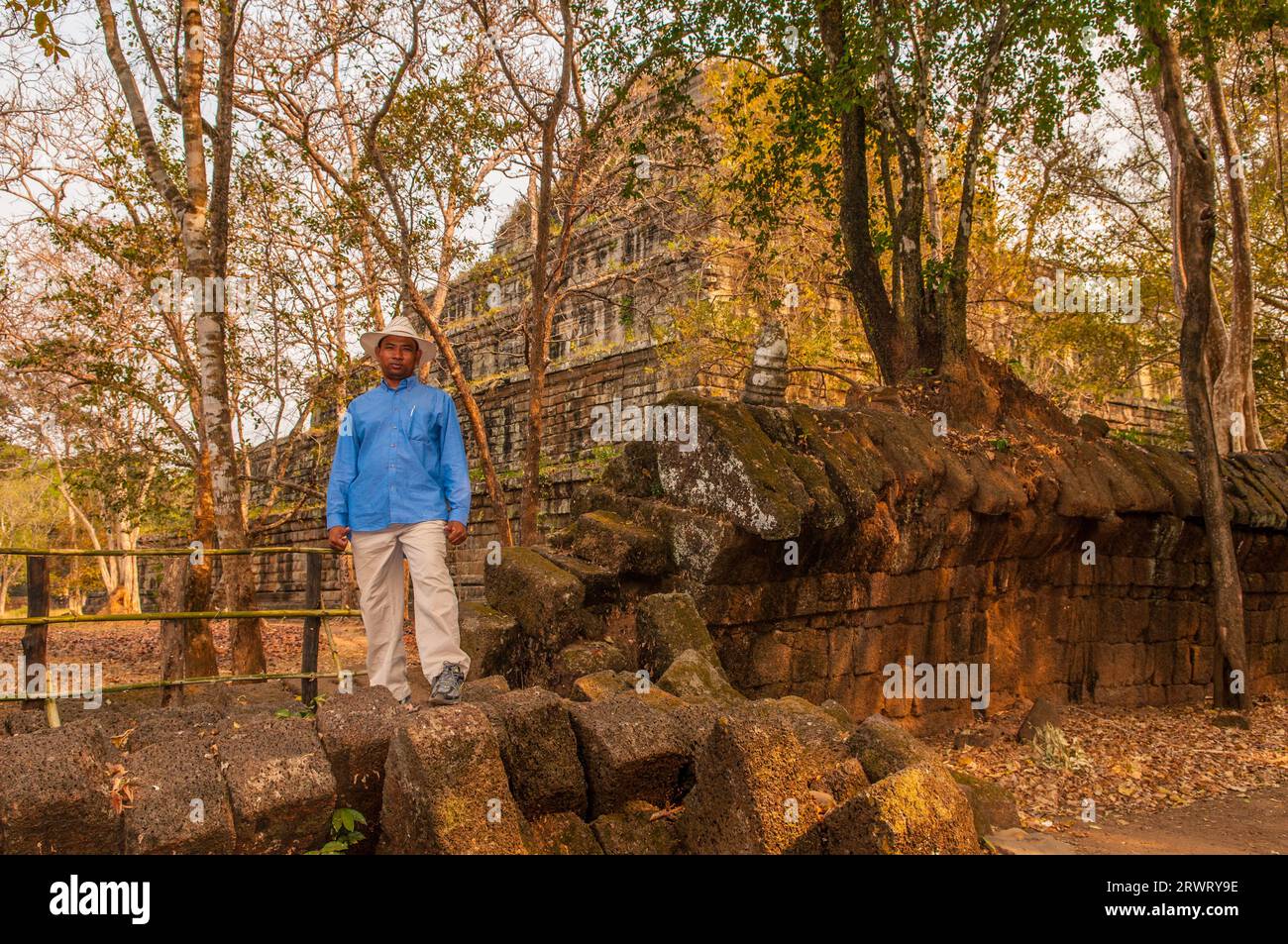 A Cambodian man, a domestic tourist, in front of the seven‑tiered ...