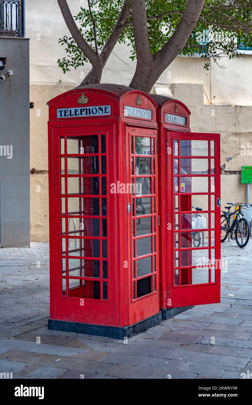 Gibraltar cityscape. Close up of empty typical English red telephone ...