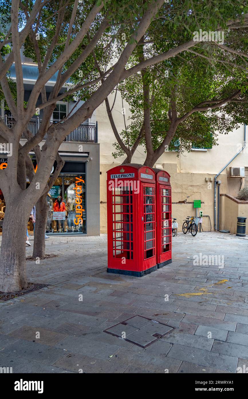 Gibraltar cityscape. Close up of empty typical English red telephone ...
