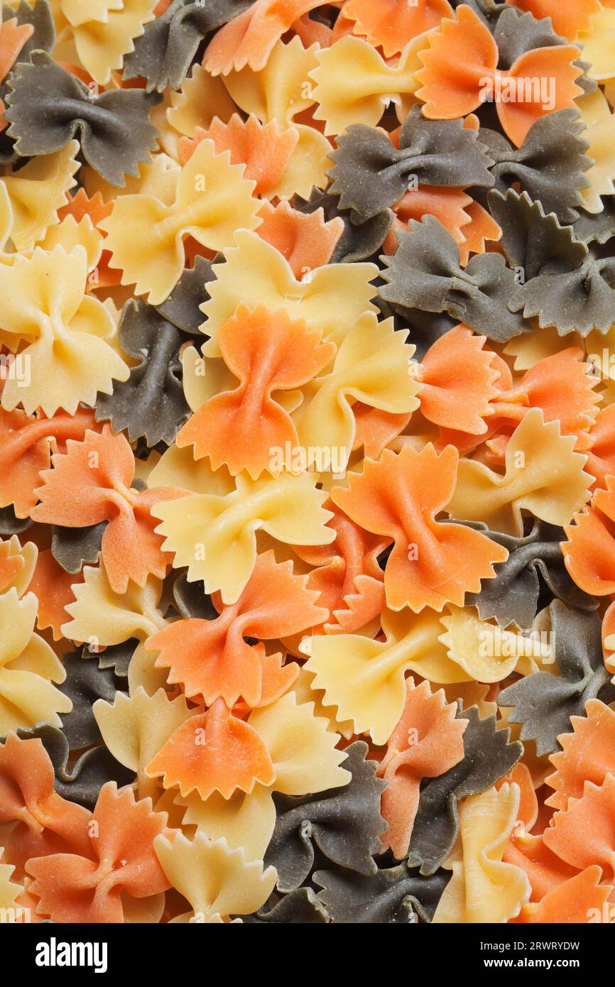 Three colored uncooked pasta texture Stock Photo - Alamy