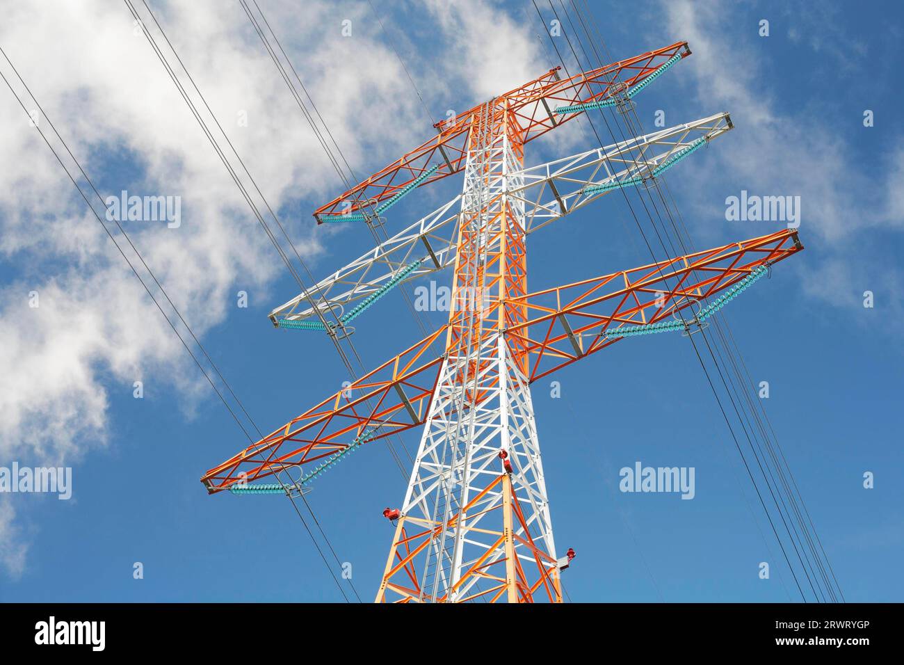 High voltage power lines transmission tower with sky background Stock ...