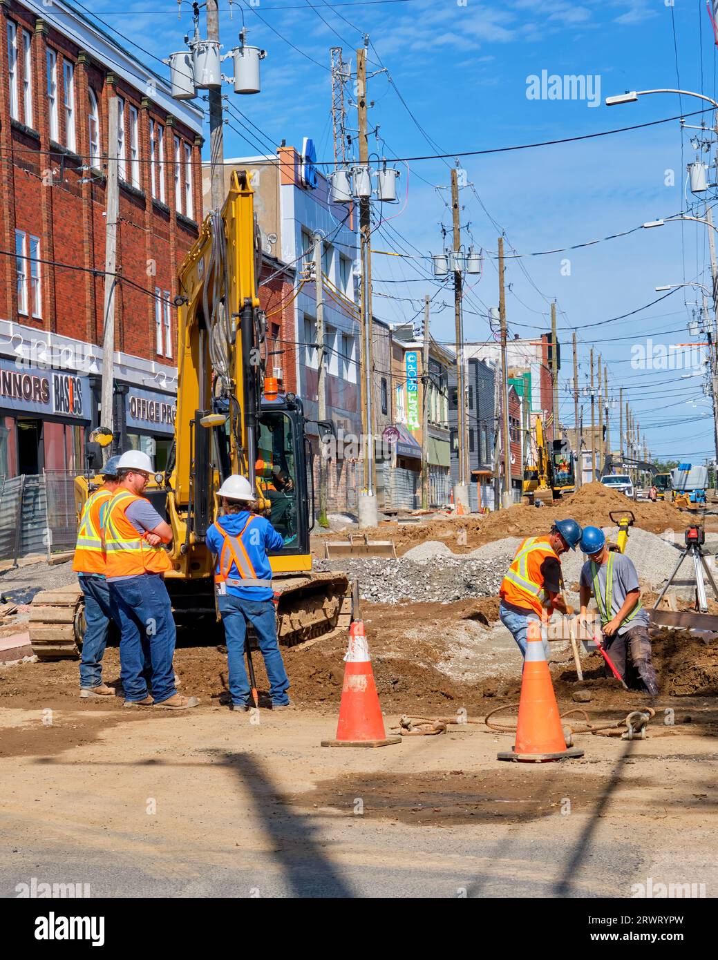 Workers are installing new water mains on a downtown street Stock Photo ...