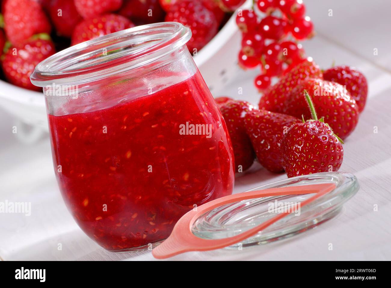 Three-fruit jam in a jar Stock Photo - Alamy