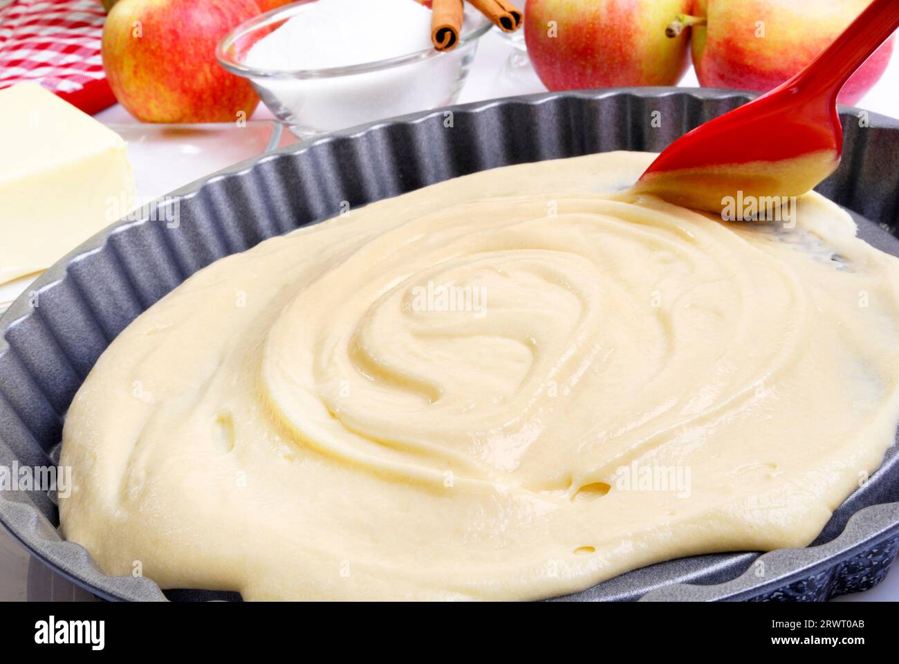 Cake batter in a cake tin Stock Photo - Alamy