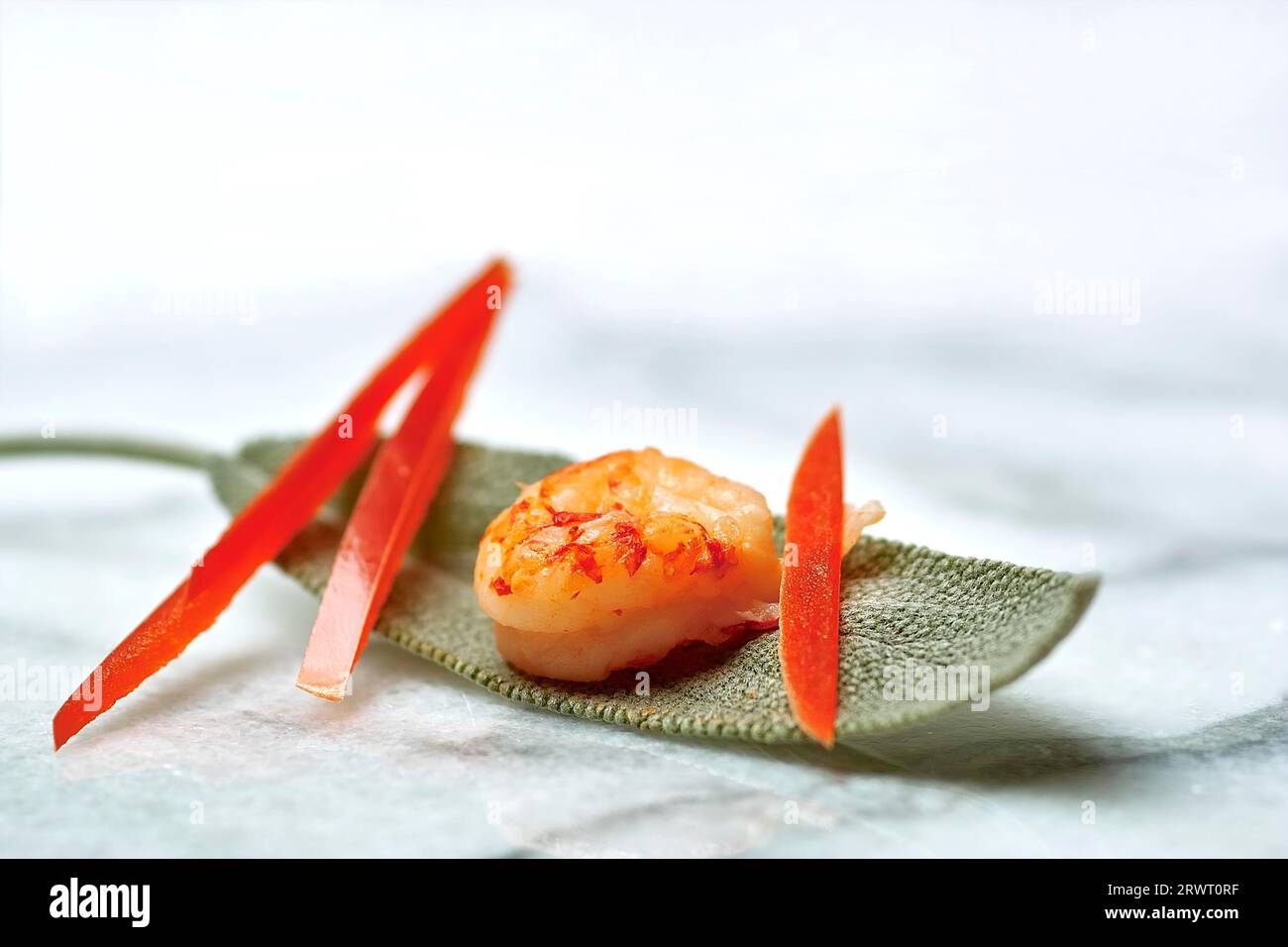 Crayfish meat garnished with strips of paprika Stock Photo - Alamy