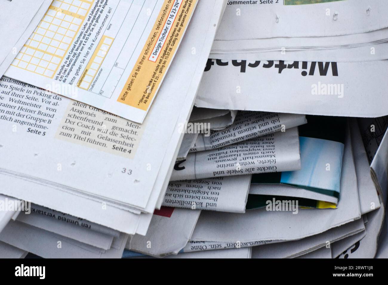 Waste paper, raw material and waste Stock Photo - Alamy