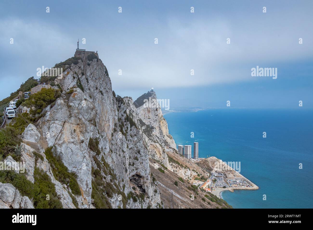 The Rock of Gibraltar peak shrouded in clouds. Spectacular view of The ...