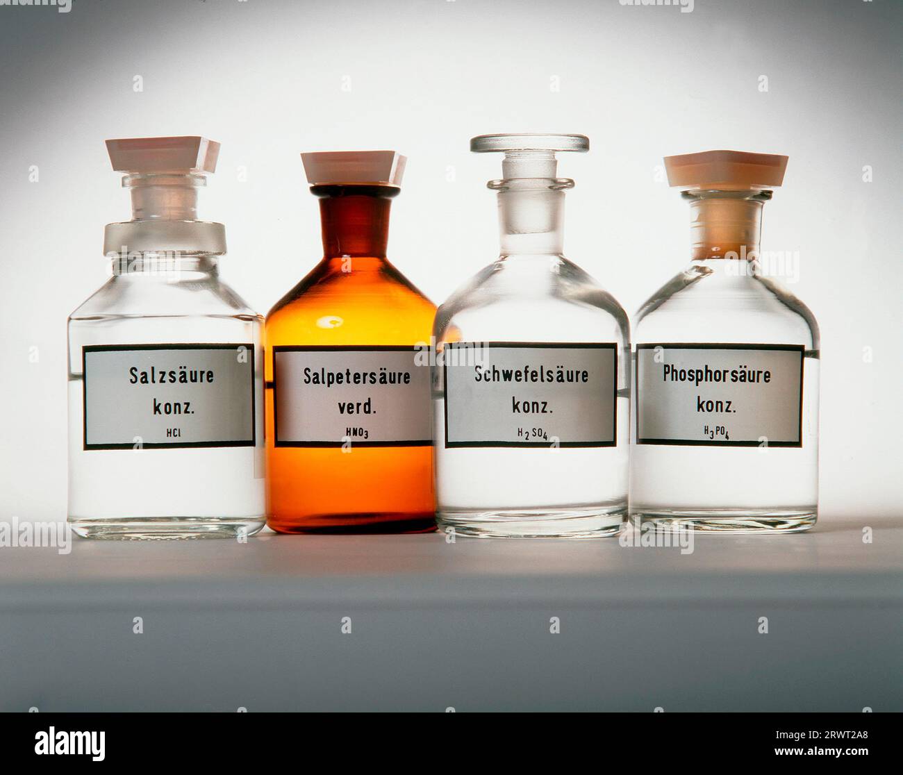Laboratory bottles with acids Stock Photo - Alamy