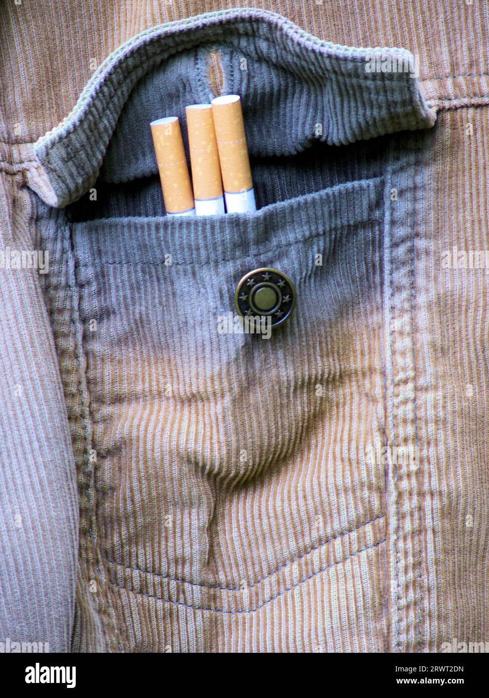Three cigarettes in a beige-brown corduroy jacket pocket, detail Stock ...