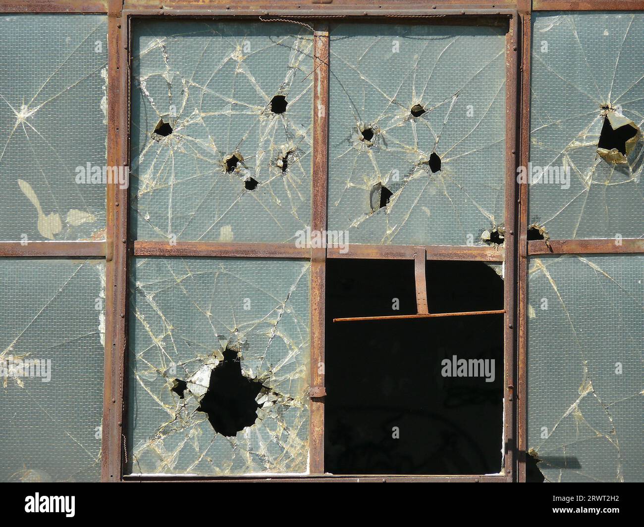 Old window of a factory with broken panes Stock Photo - Alamy