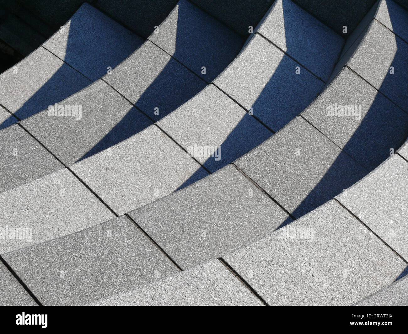 Shaded grey stone staircase, taken slightly diagonally Stock Photo - Alamy