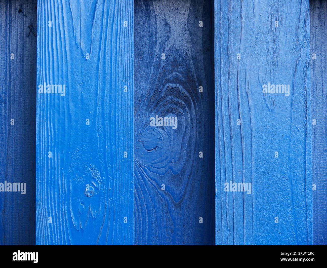 Wooden beams as wall cladding outside in light and dark blue Stock ...