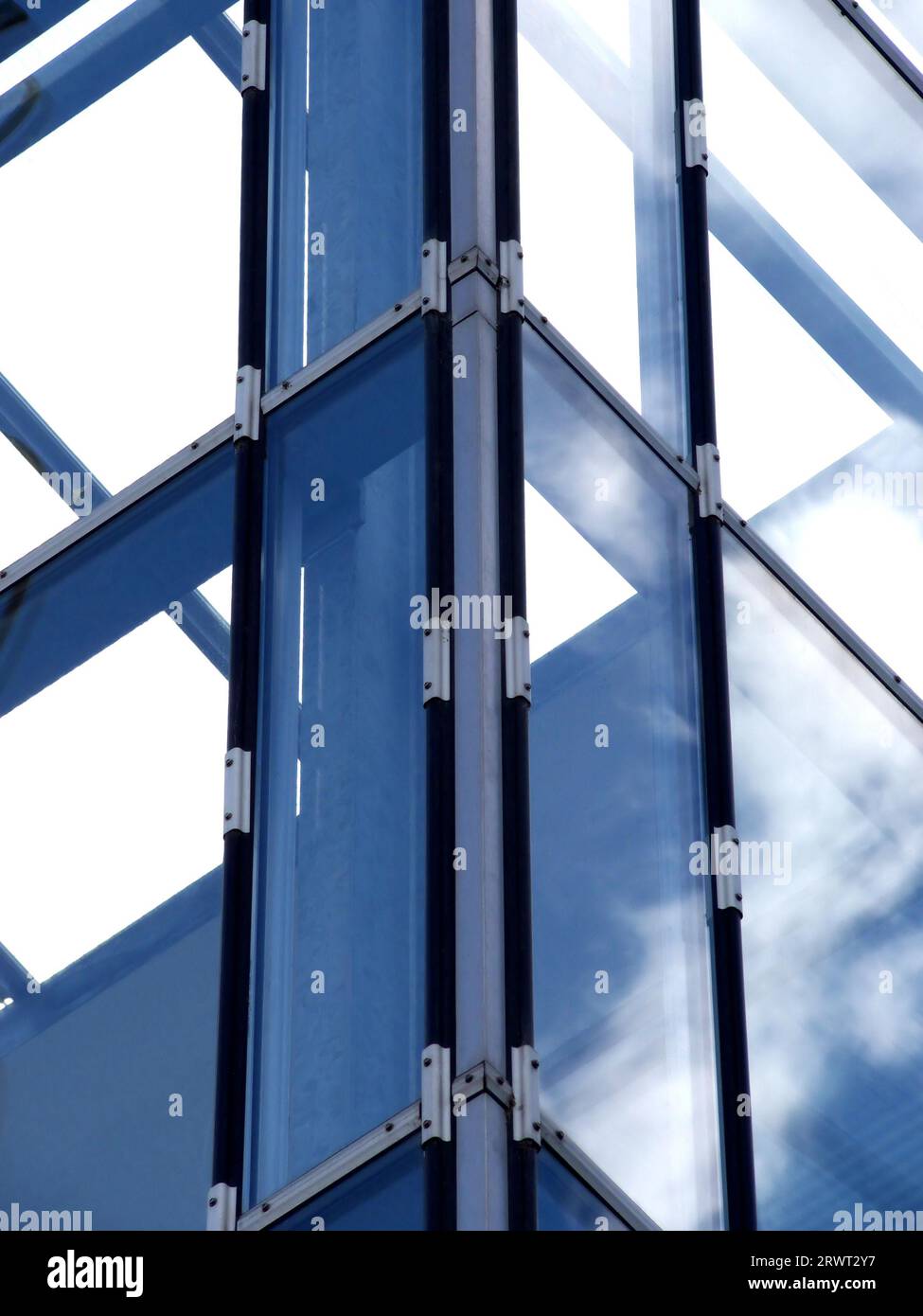 Office building corner, detail, with sky reflection Stock Photo - Alamy