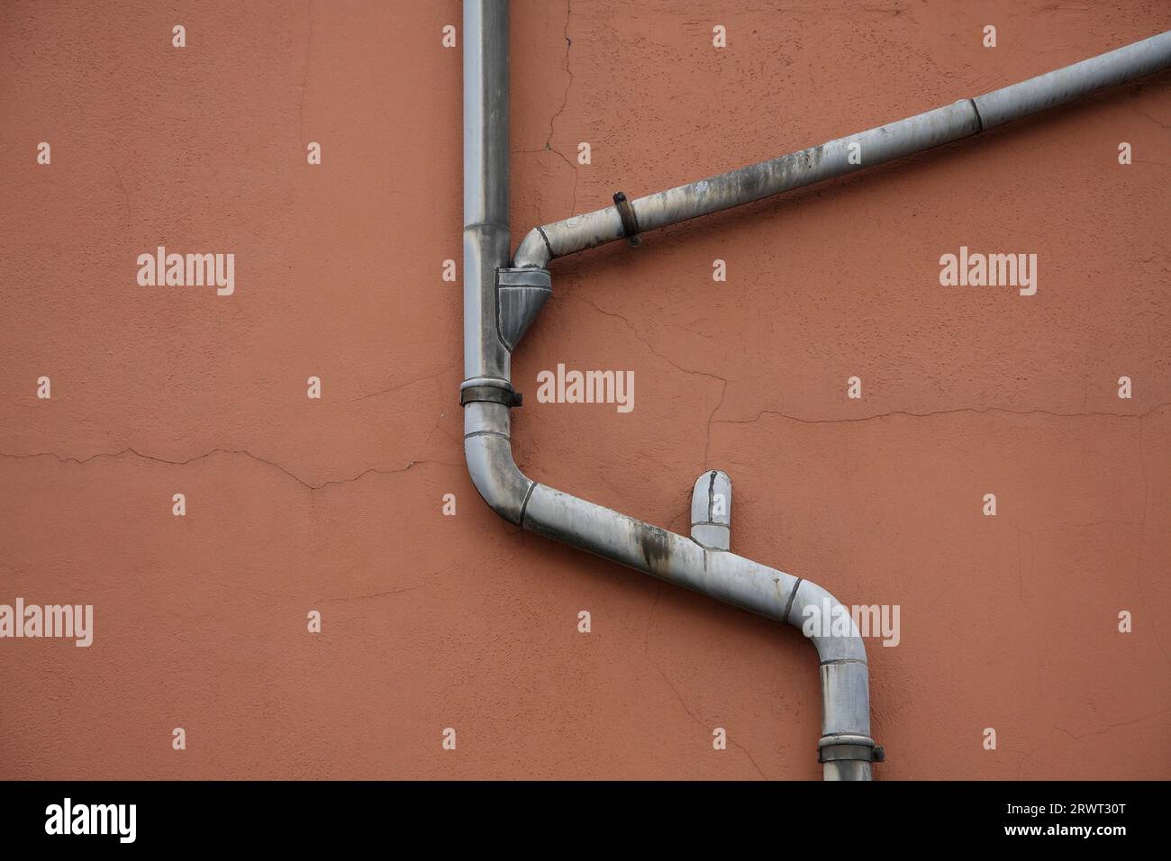 Angled rain gutters in front of brown house wall, detail Stock Photo ...