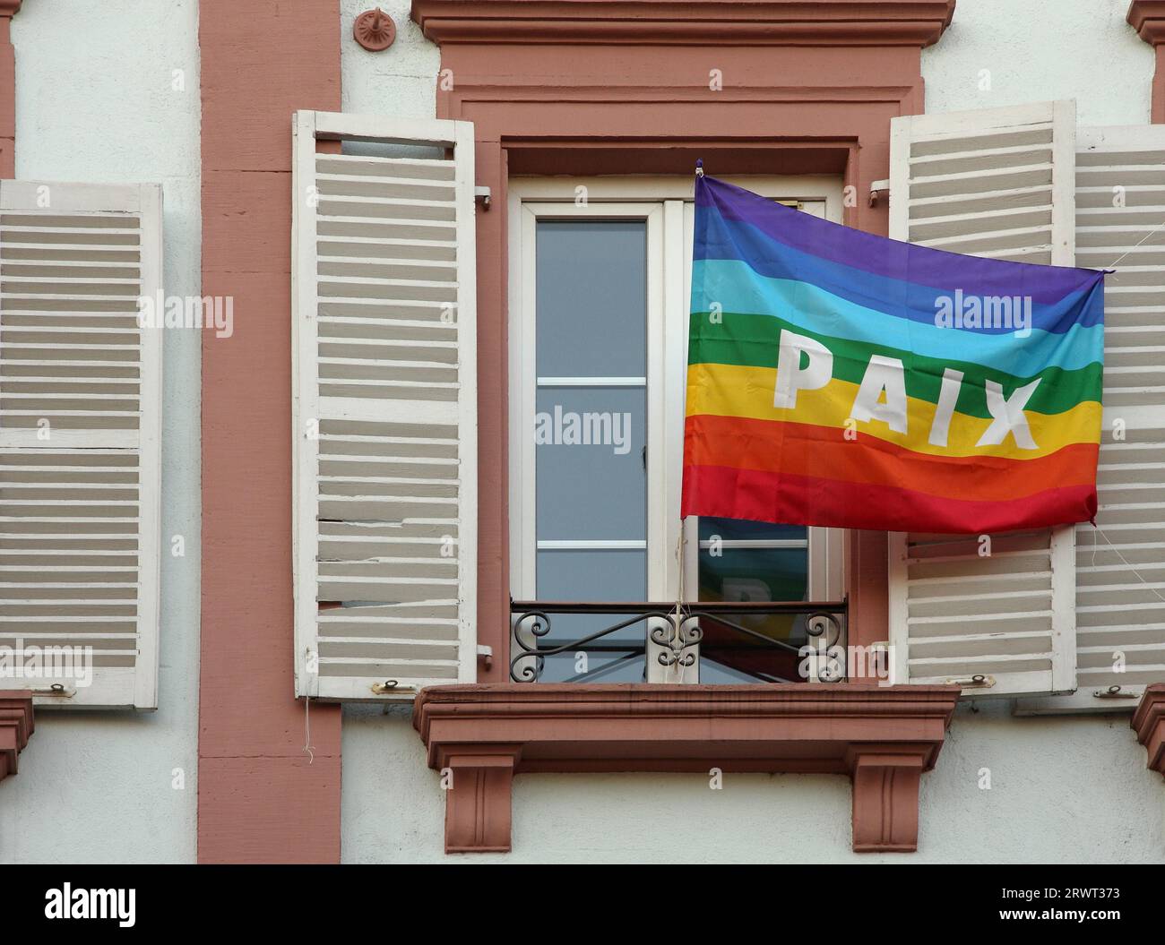 Window with flag in rainbow colours and white letters Stock Photo - Alamy
