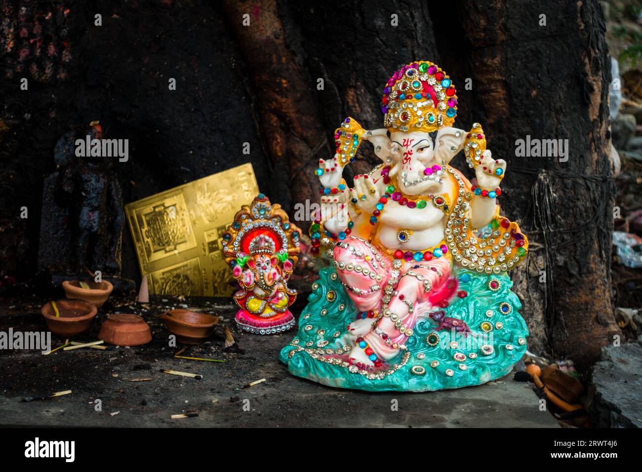 Sculpture of Lord Ganesha beneath a tree, used for worship. Uttarakhand ...