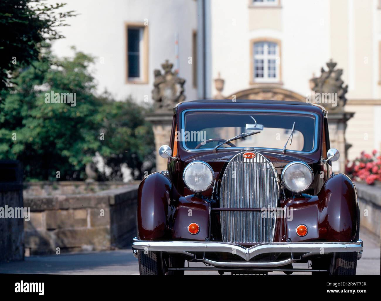 Bugatti classic car in front of castle facade Stock Photo - Alamy