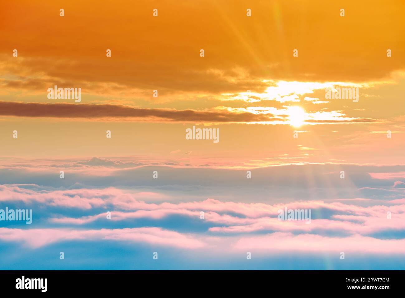 Aerial view of Mt. Asama's plume and the morning sun among clouds ...