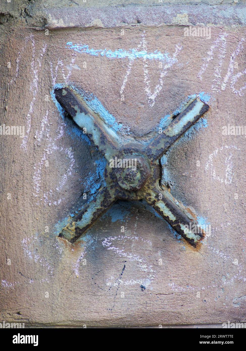Detailed view of a house wall with a cross-shaped tension anchor Stock ...