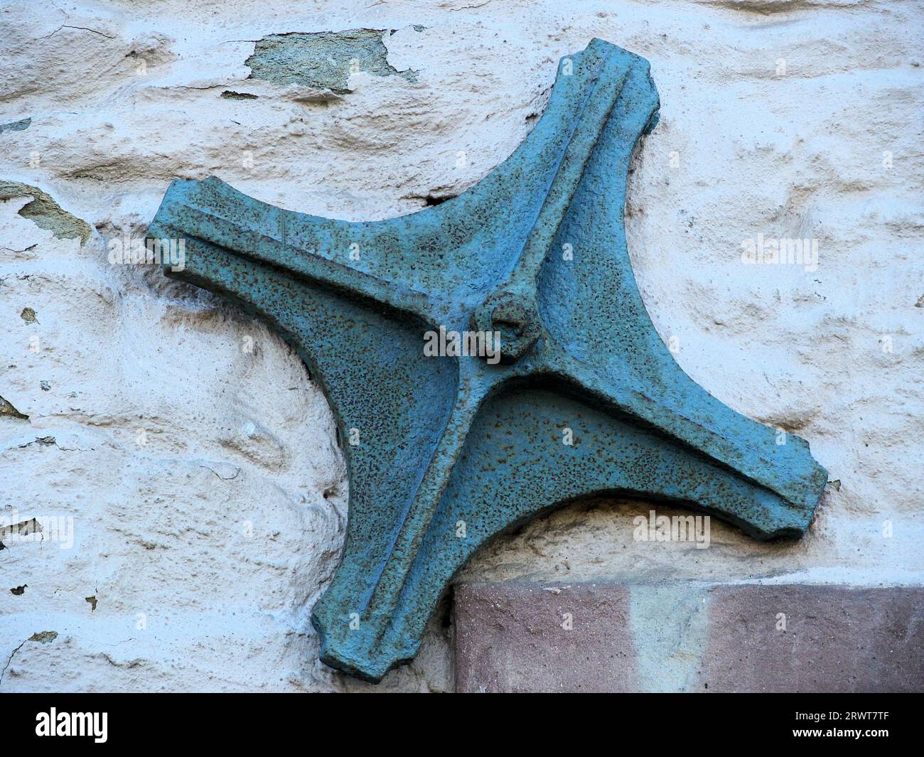Shapely, turquoise, painted tension anchor, in the background, white ...