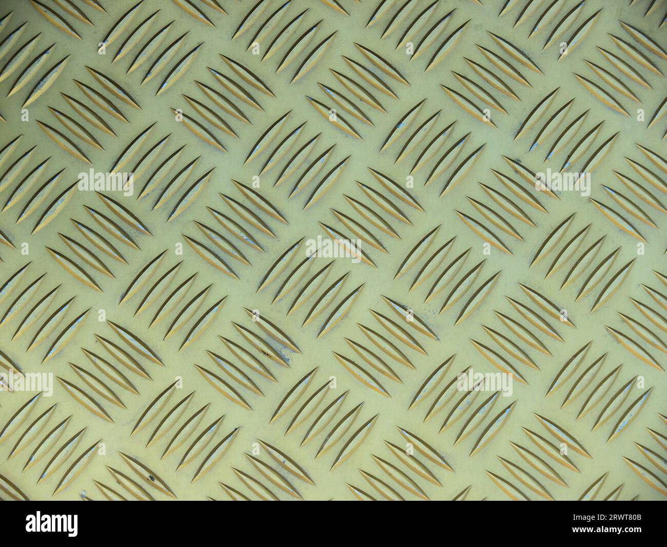 Gold-coloured chequer plate, taken to fill the format Stock Photo - Alamy