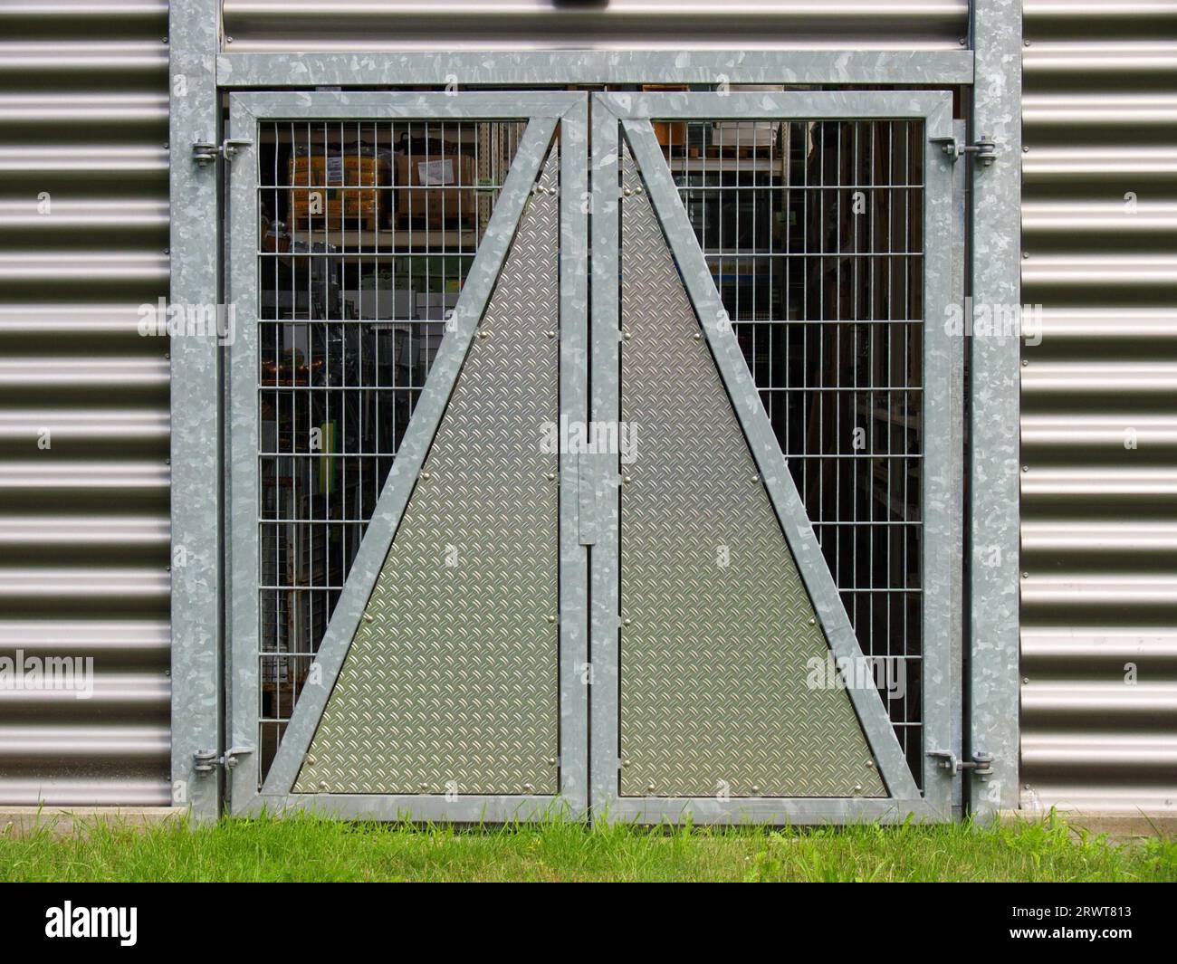 Steel door of a department store, in the foreground, a small piece of ...