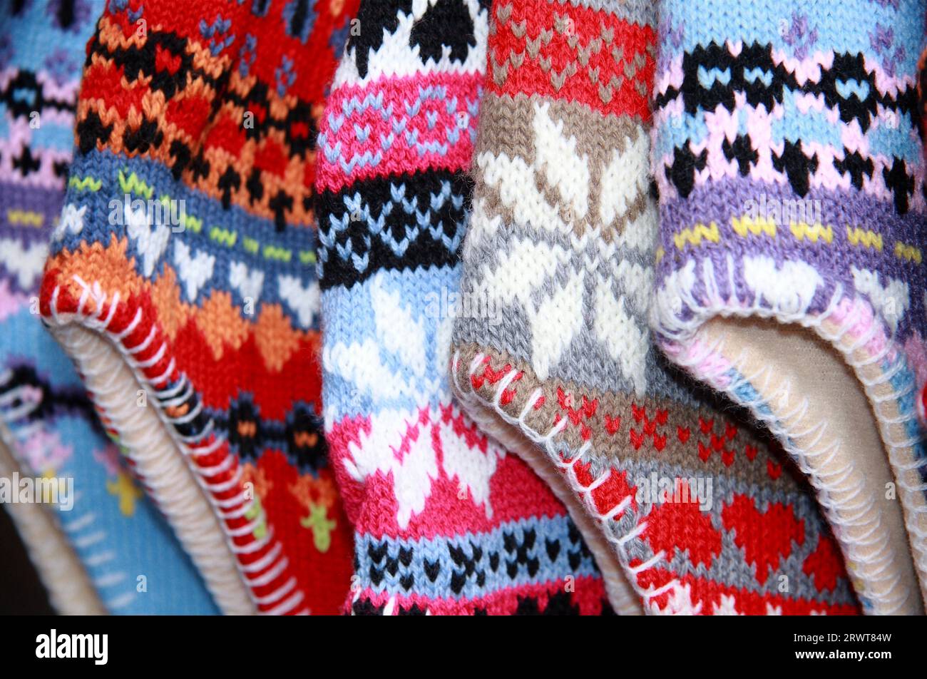 Several caps with different knitting patterns in different colours ...