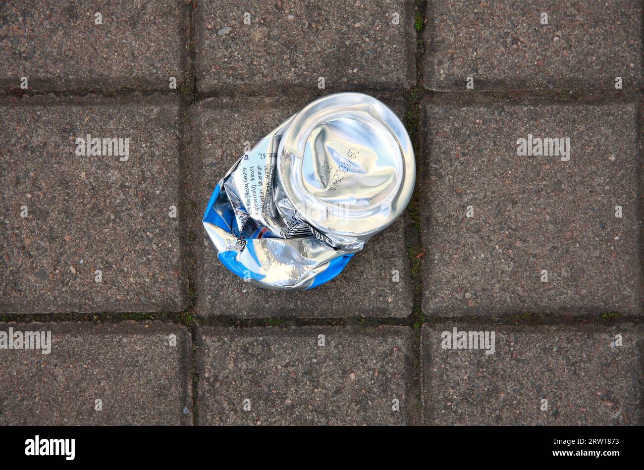 Folded drink can on a pavement Stock Photo - Alamy