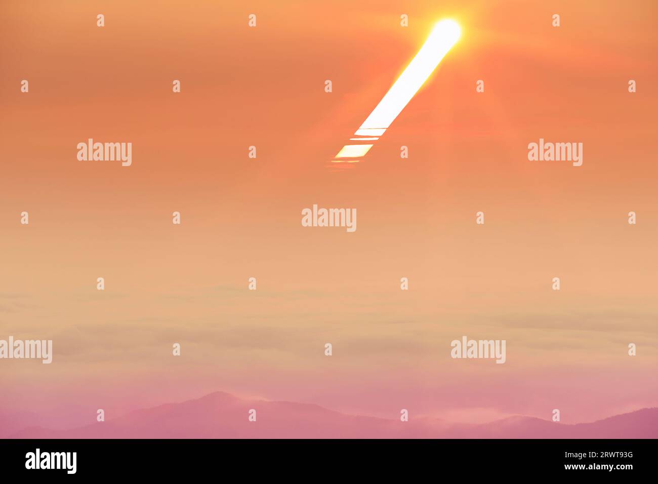 Long exposure of the rising sun and sea of clouds in the direction of ...