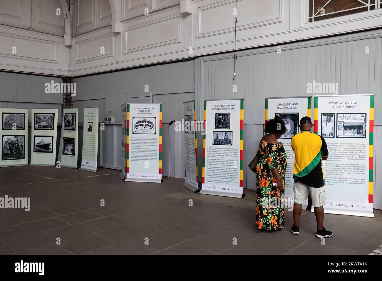 People viewing a Windrush Day exhibition / display at Tilbury Cruise ...