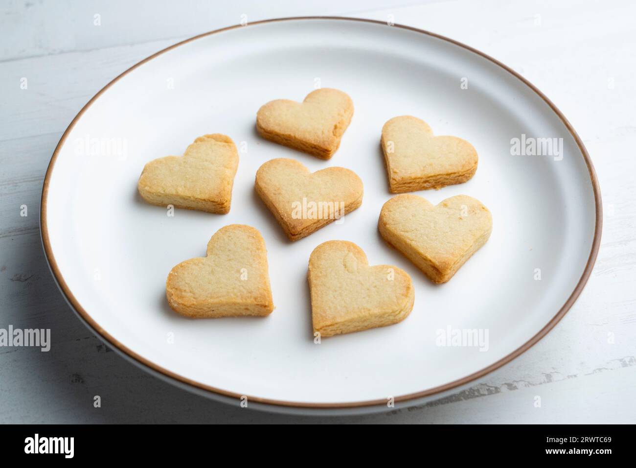 Preparing butter cookies for children with star and heart shapes Stock ...