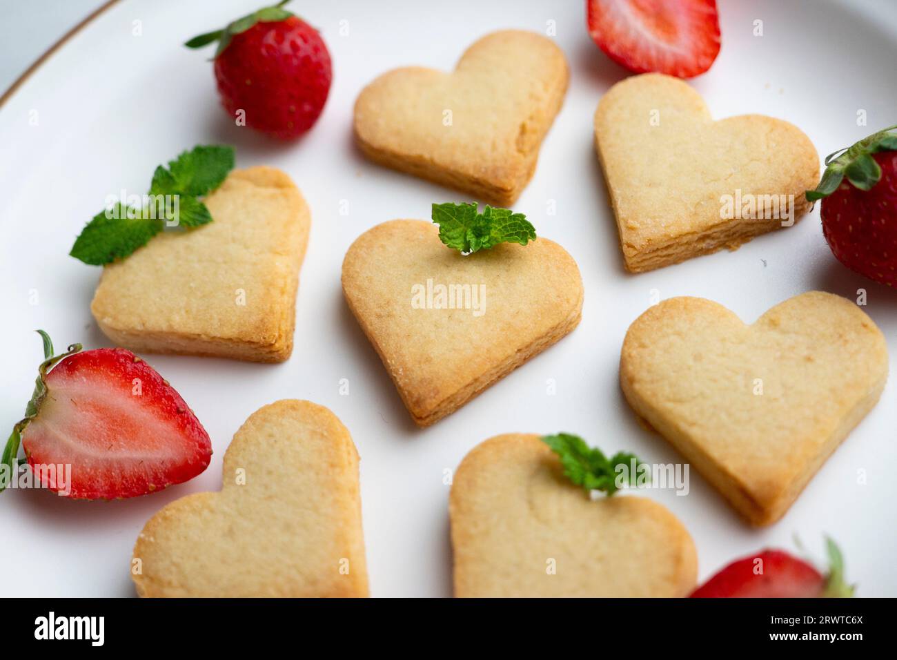 Preparing butter cookies for children with star and heart shapes Stock ...