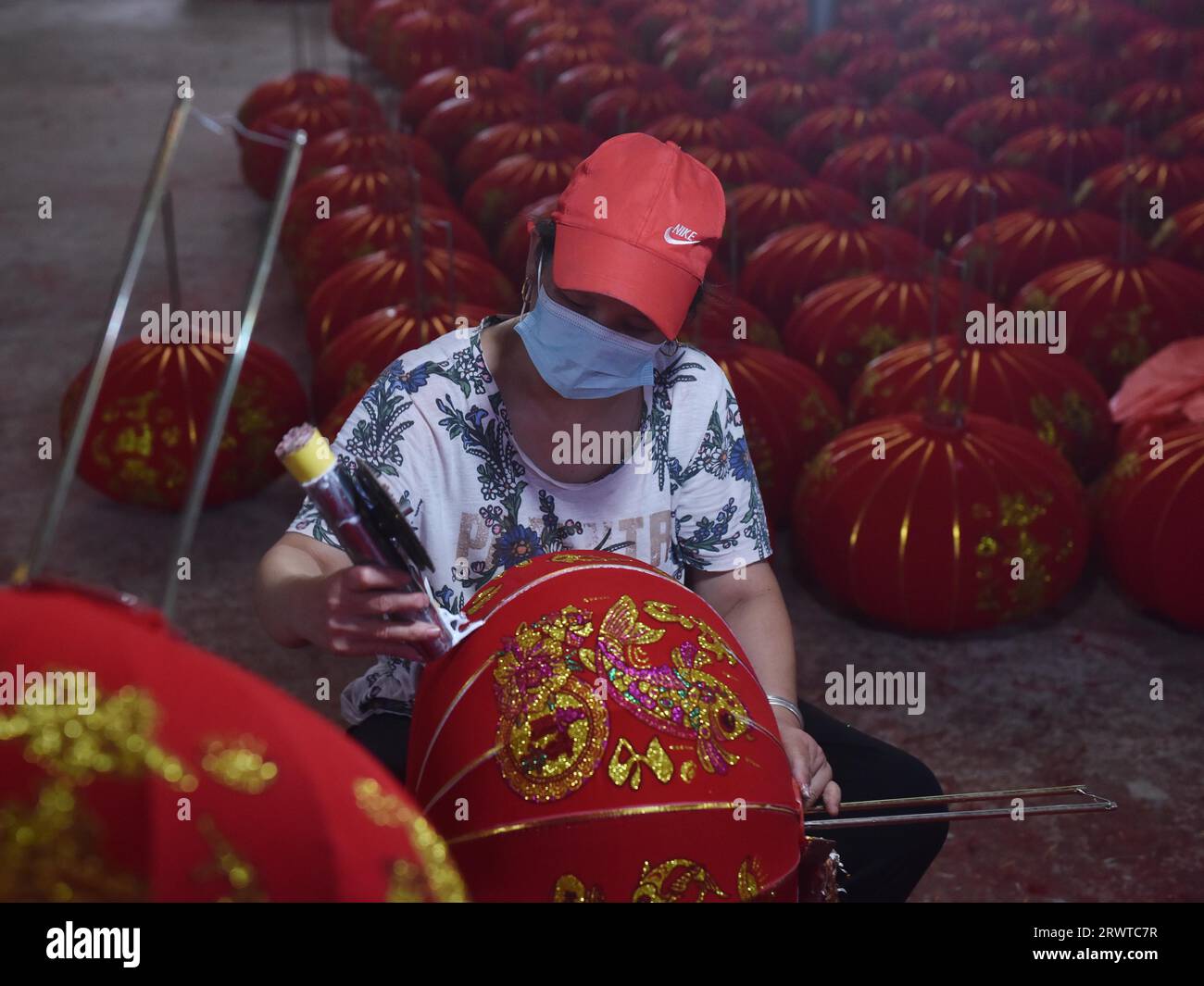 Workers make red lanterns for the upcoming Mid-Autumn Festival and ...
