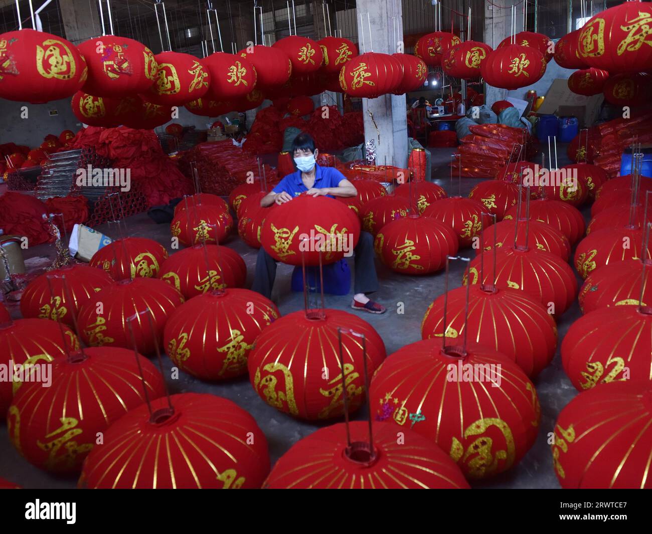 Workers make red lanterns for the upcoming Mid-Autumn Festival and ...