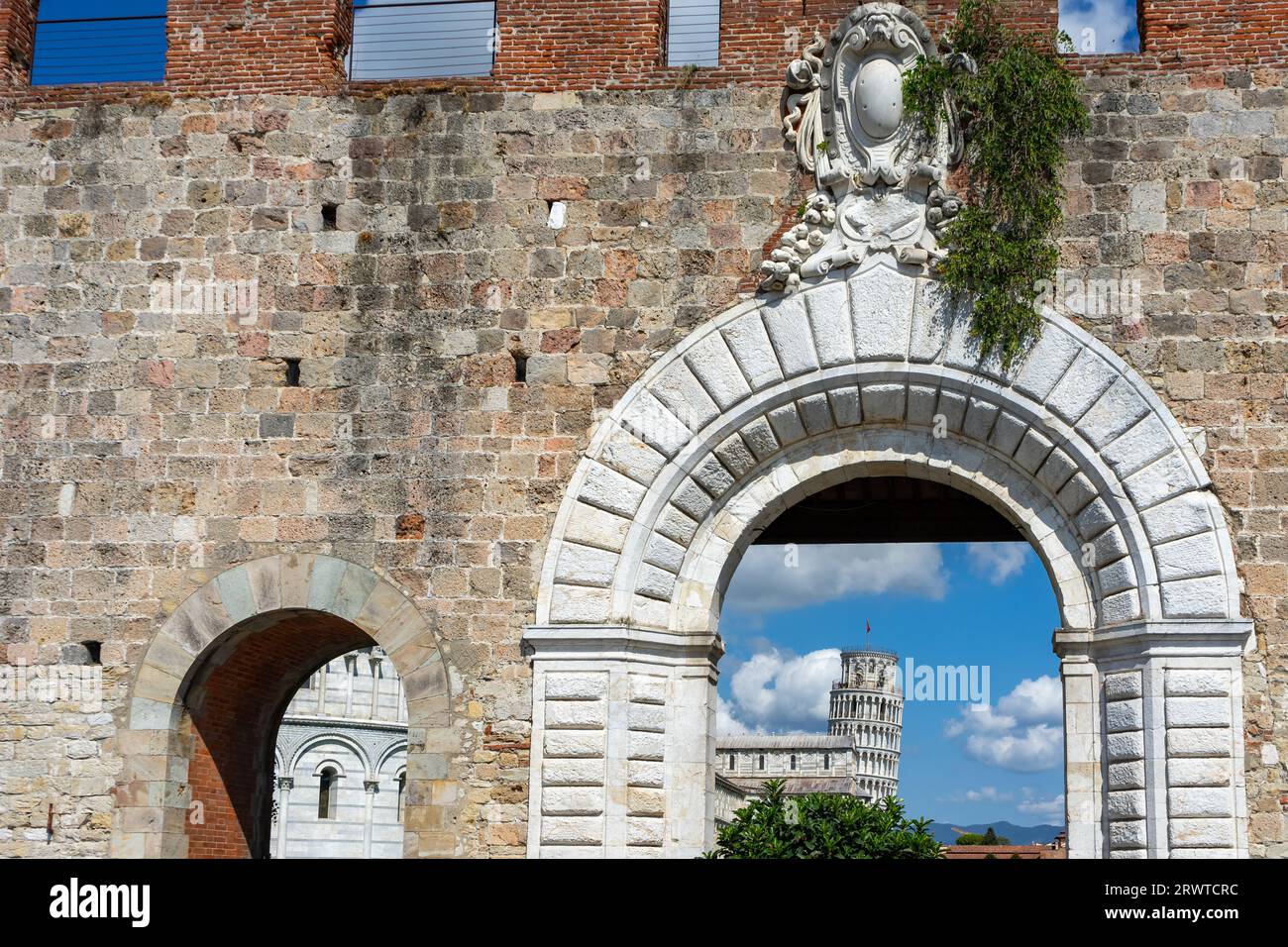 View of the Leaning Tower of Pisa from the city gate Stock Photo - Alamy