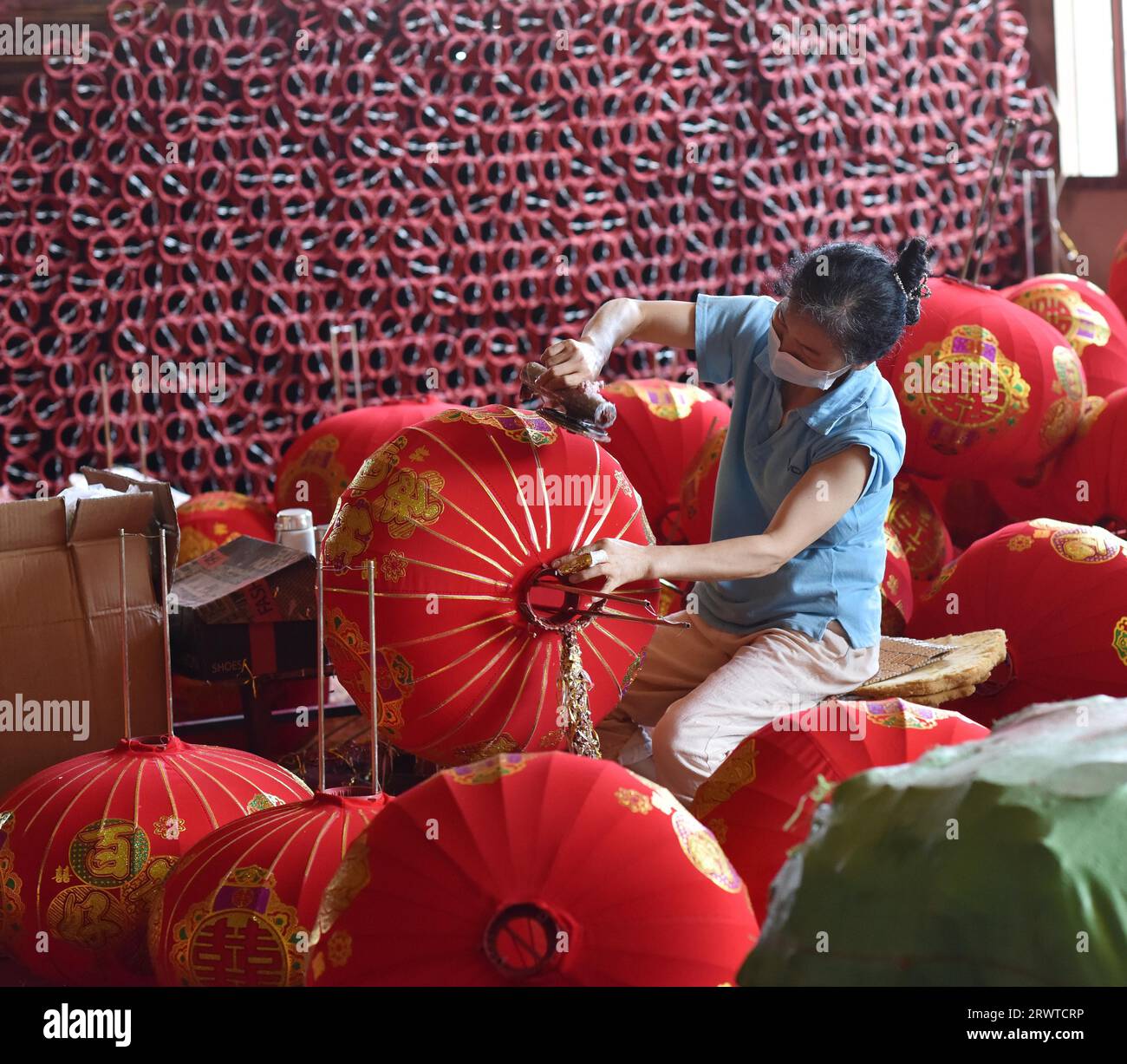 Workers make red lanterns for the upcoming Mid-Autumn Festival and ...