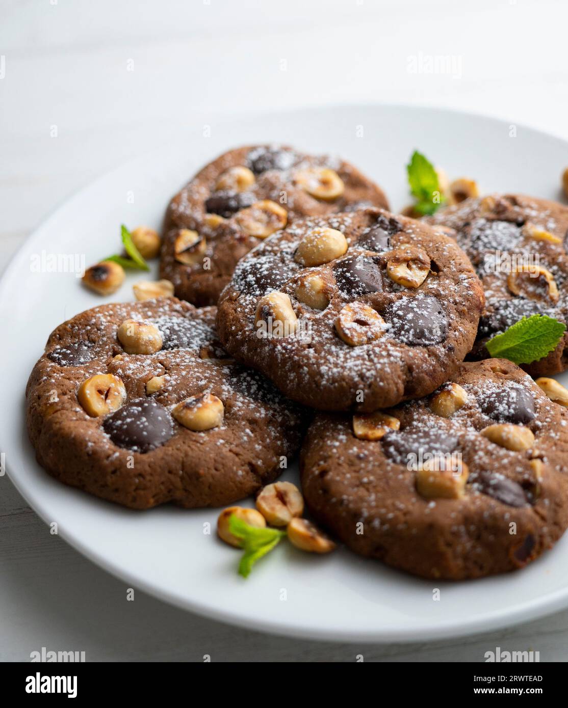 Homemade chocolate cookies with hazelnut pieces Stock Photo - Alamy