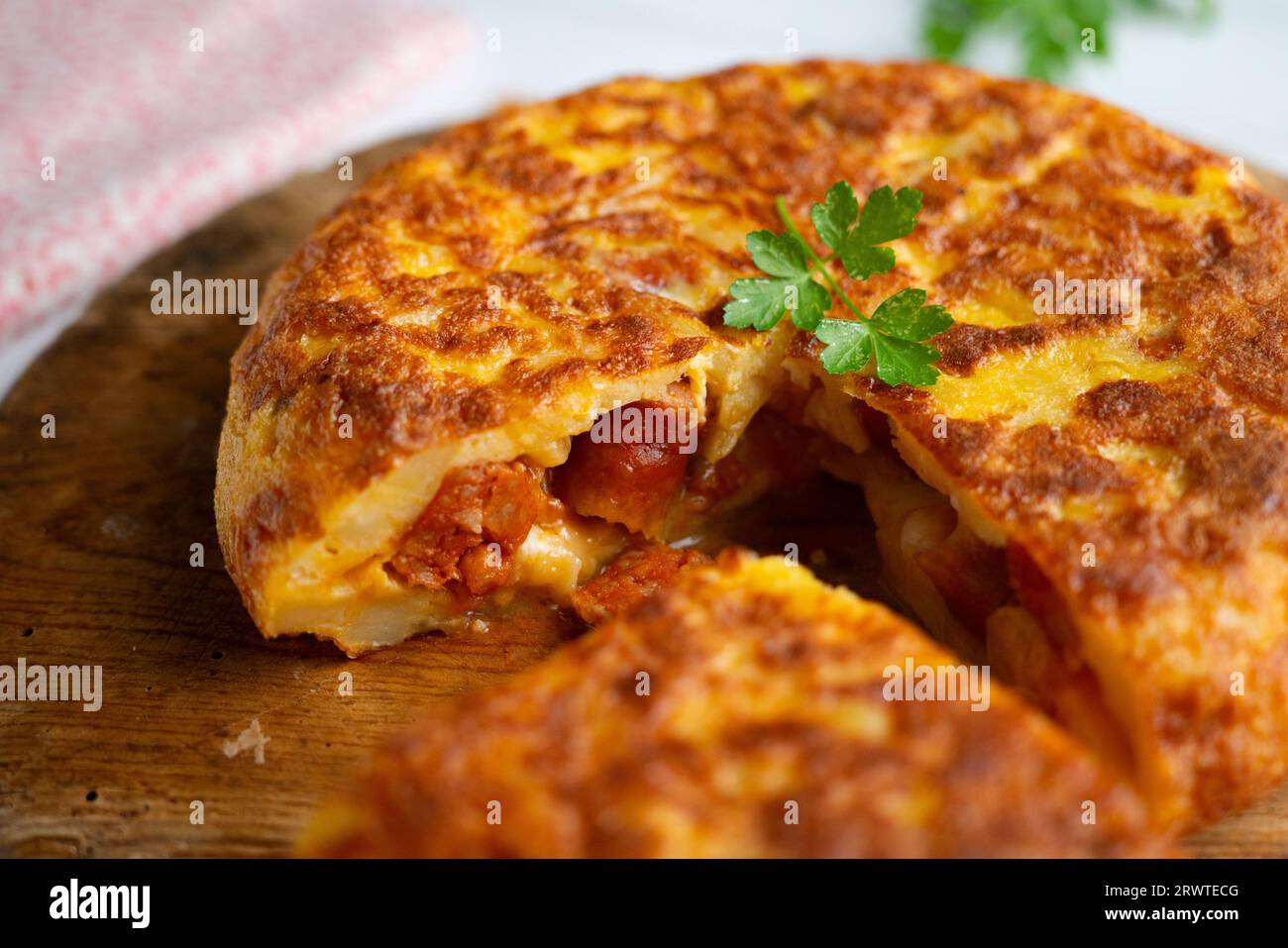 Spanish potato omelet with chistorra, a type of traditional chorizo ...