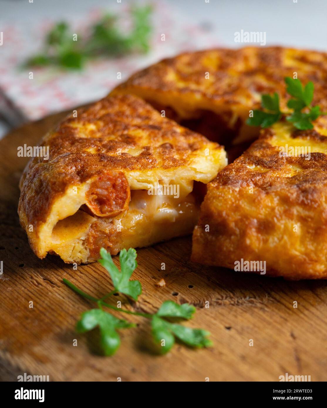 Spanish potato omelet with chistorra, a type of traditional chorizo ...